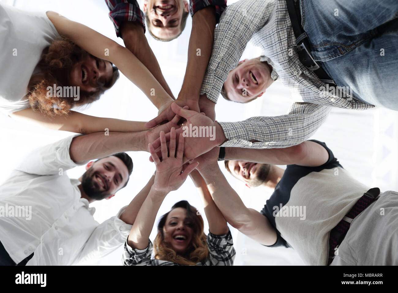 business team with hands clasped together Stock Photo - Alamy
