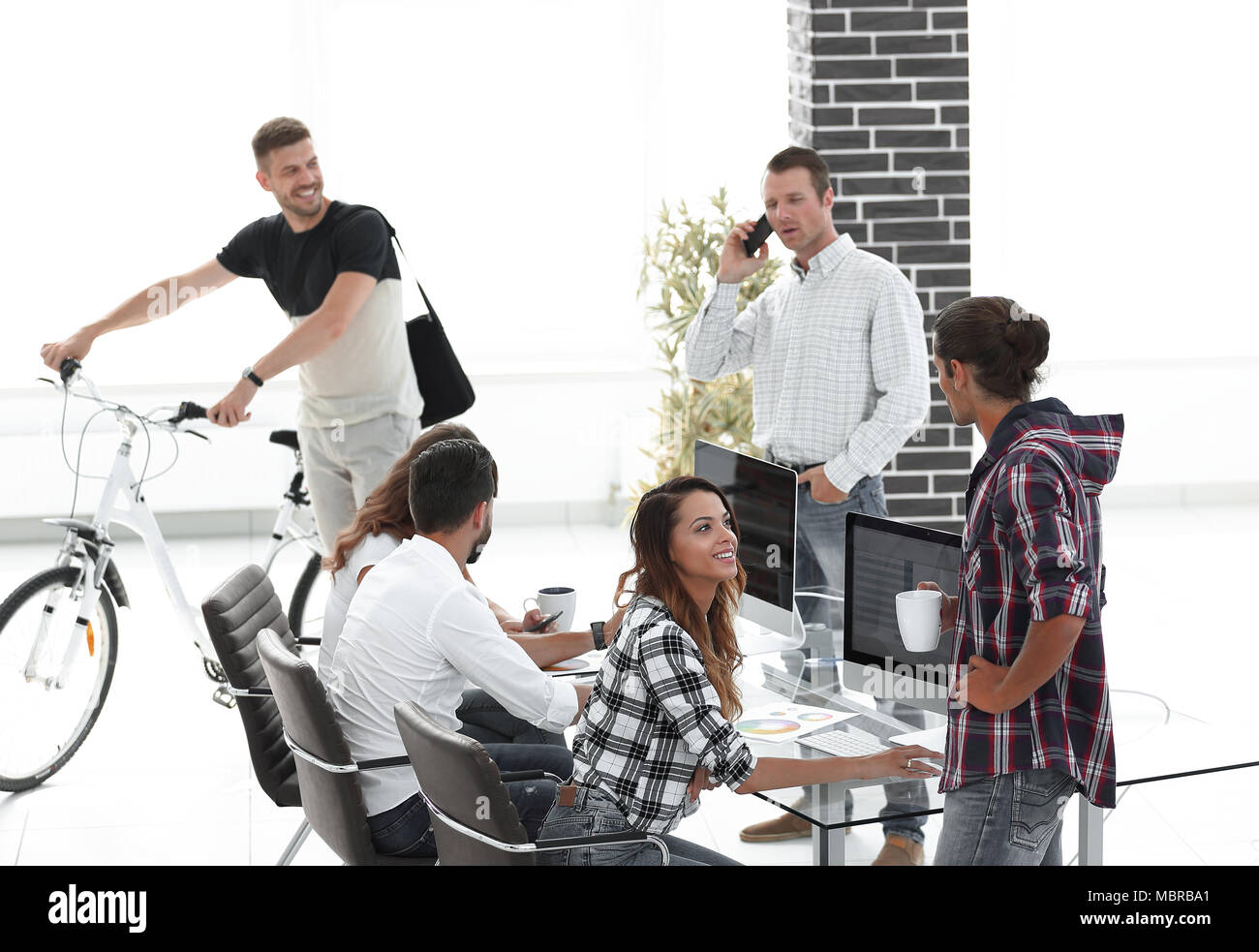 group of young employees in a modern office Stock Photo - Alamy