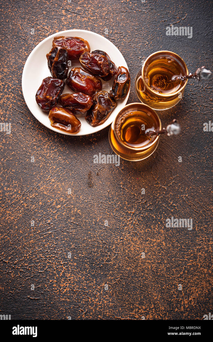 Traditional arabic tea and dry dates Stock Photo - Alamy