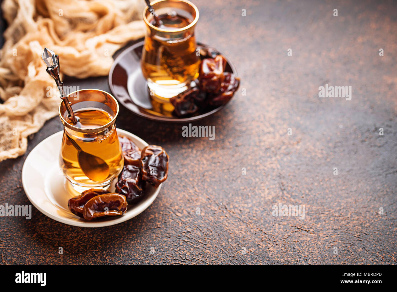 Traditional arabic tea and dry dates Stock Photo - Alamy