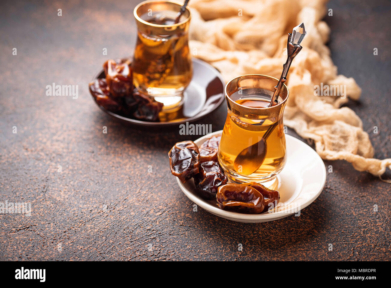 Traditional arabic tea and dry dates Stock Photo - Alamy