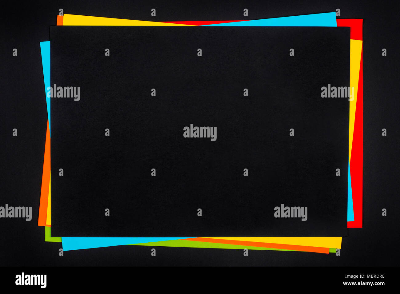 Colorful paper sheets stack on black background Stock Photo - Alamy