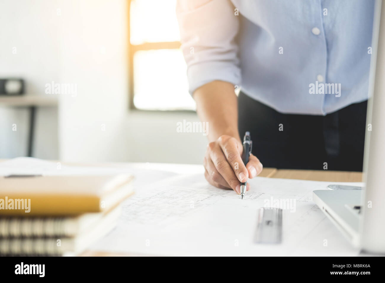 Person's engineer Hand Drawing Plan On Blue Print with architect ...