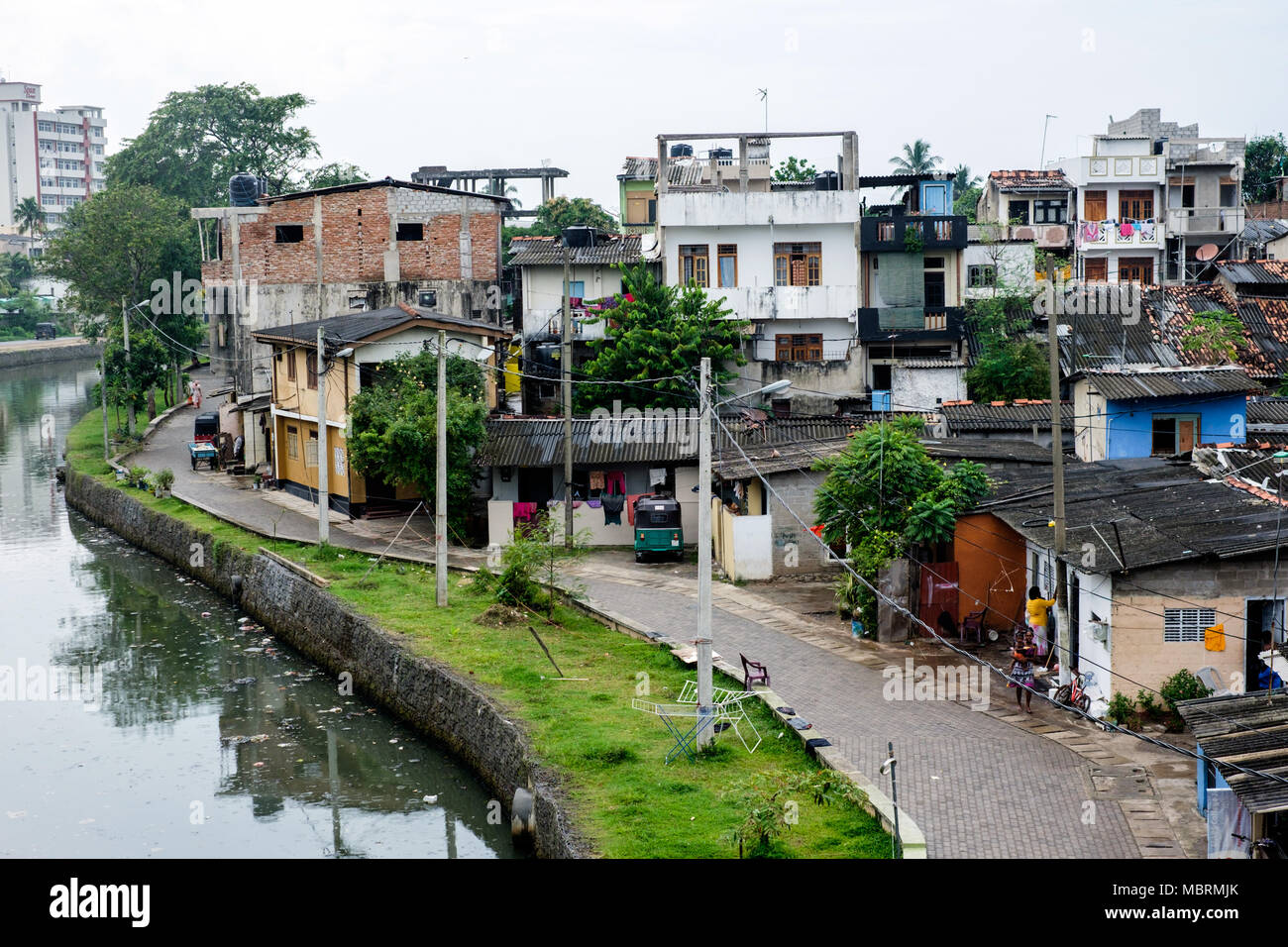Colombo, Sri Lanka - November 12, 2015: Polluted river next to a living ...