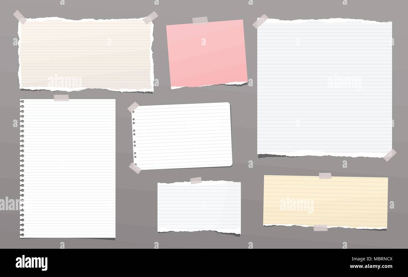 Torn note, notebook paper pieces for text stuck on dark gray background ...