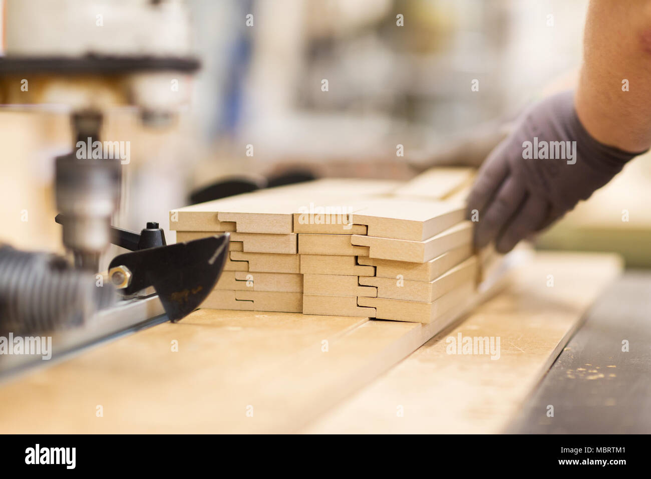 close up of carpenter hand with boards at factory Stock Photo - Alamy