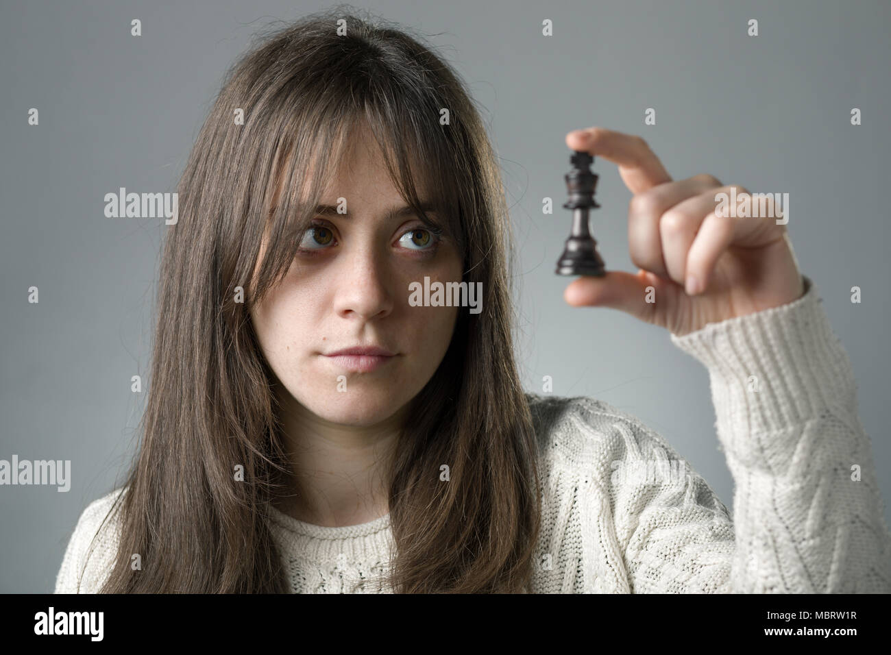 Hand holding chess piece hi-res stock photography and images - Alamy