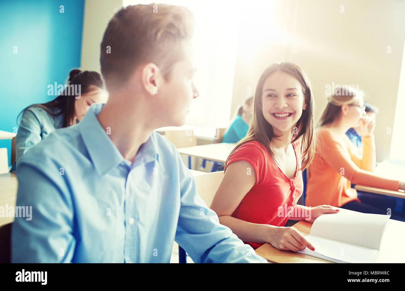 group of happy students talking at school break Stock Photo - Alamy