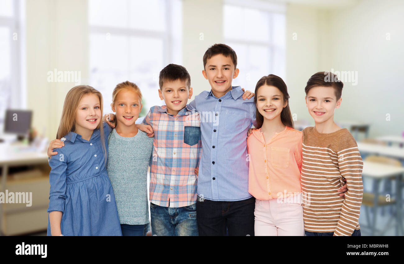 happy students hugging at school Stock Photo - Alamy