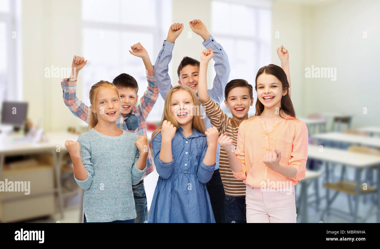 happy students celebrating victory at school Stock Photo - Alamy