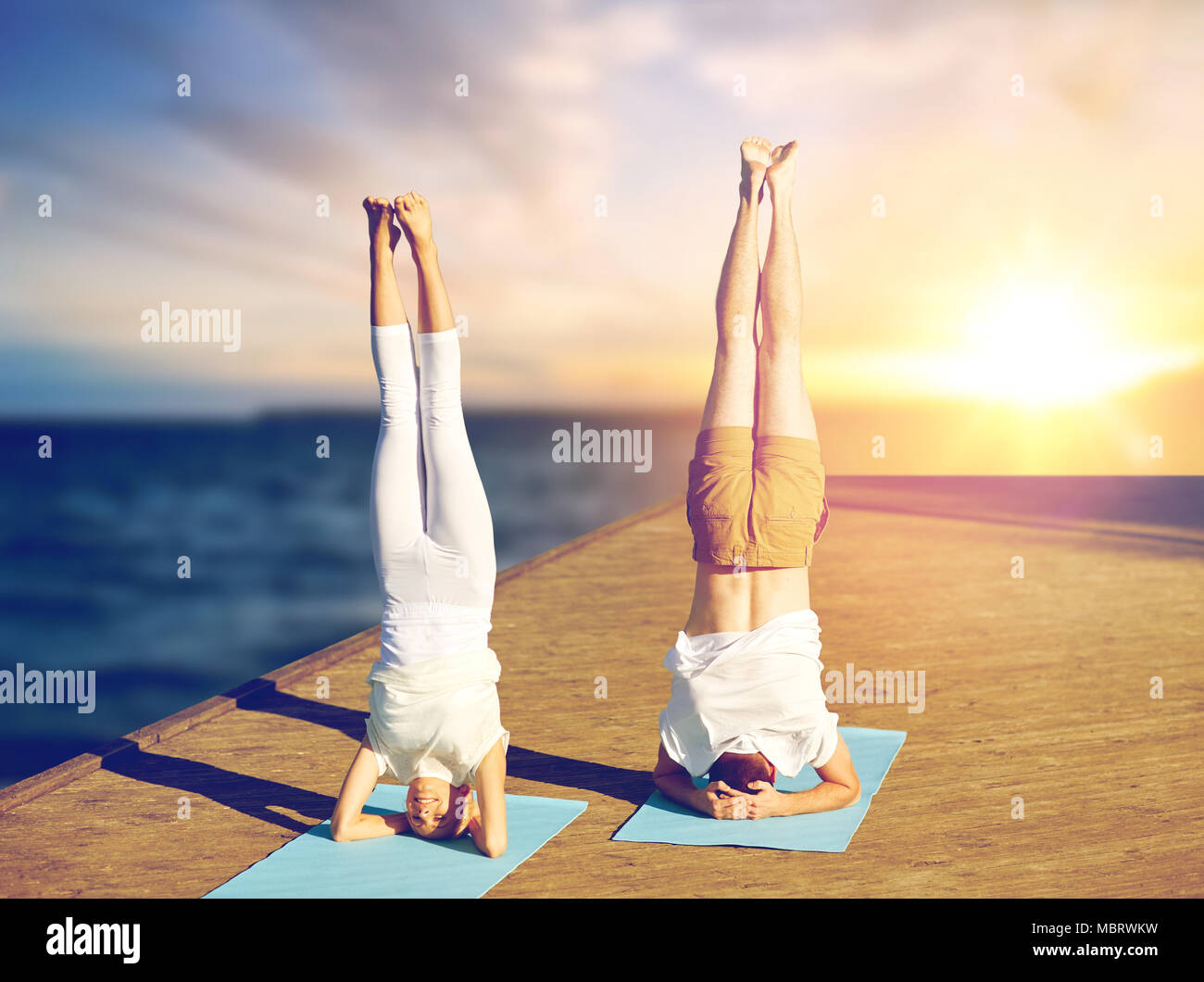 Headstand couple hi-res stock photography and images - Alamy