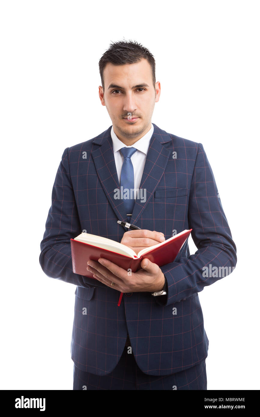 Young handsome salesman holding and writing in agenda as teacher ...