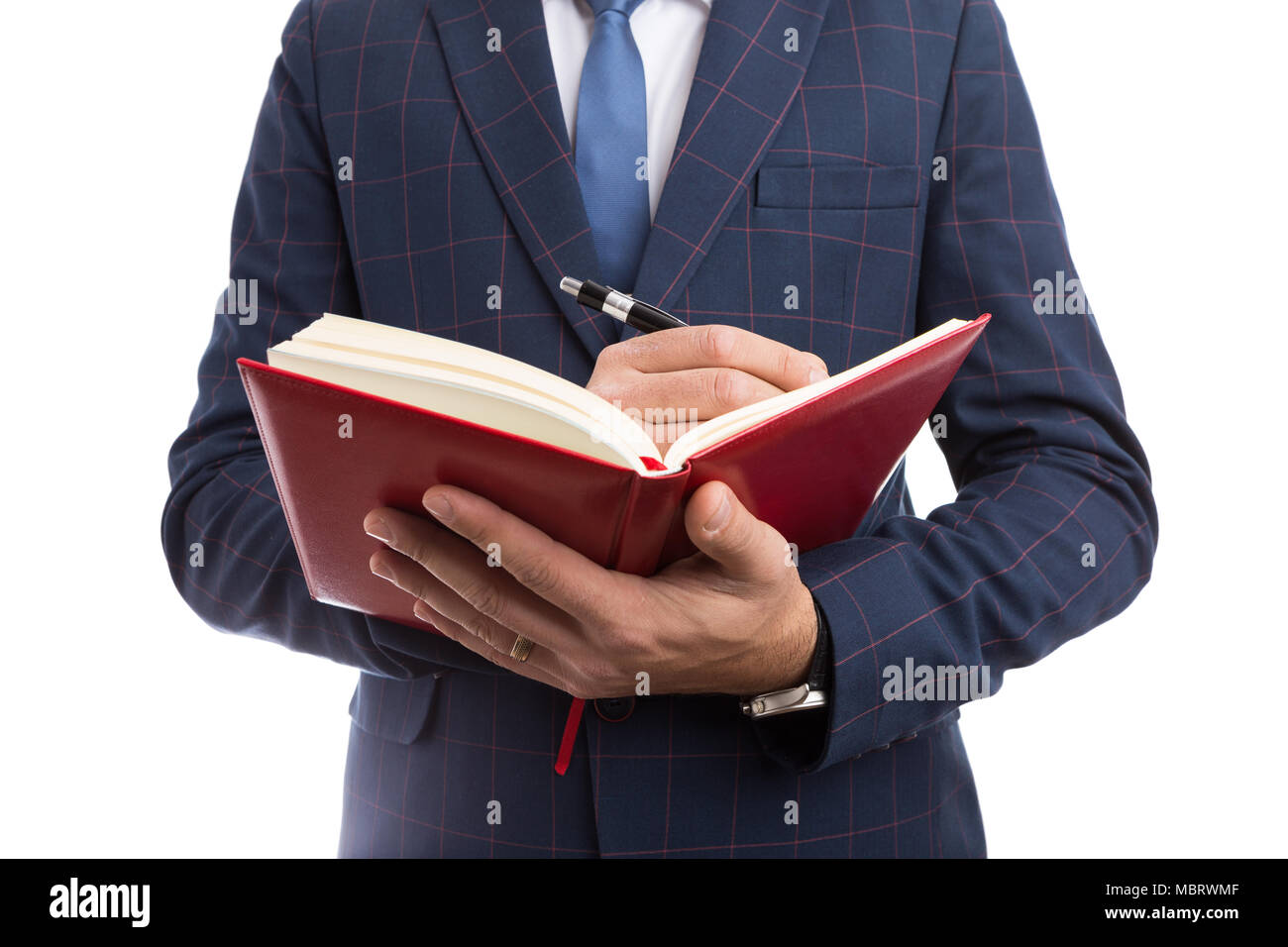 Close-up of salesman holding and writing in agenda as elegant assistant ...