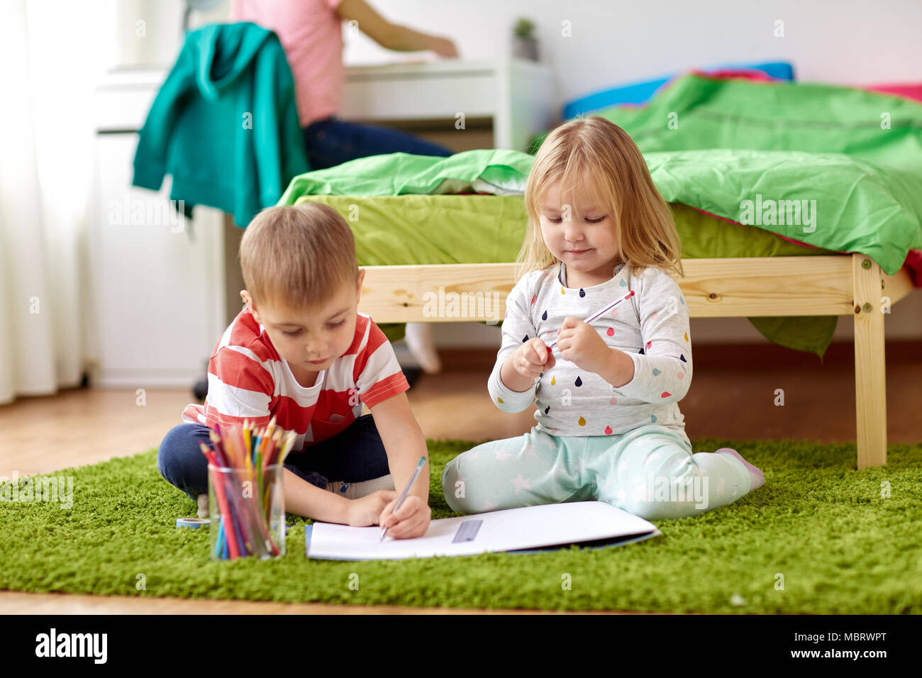 happy kids drawing at home Stock Photo - Alamy