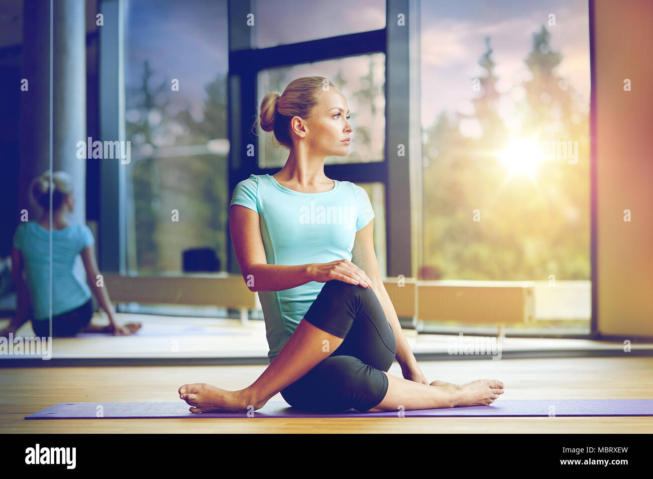 Woman stretching leg training yoga hi-res stock photography and images - Alamy