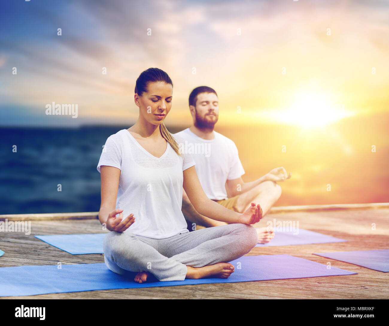 Couple in lotus position hi-res stock photography and images - Alamy