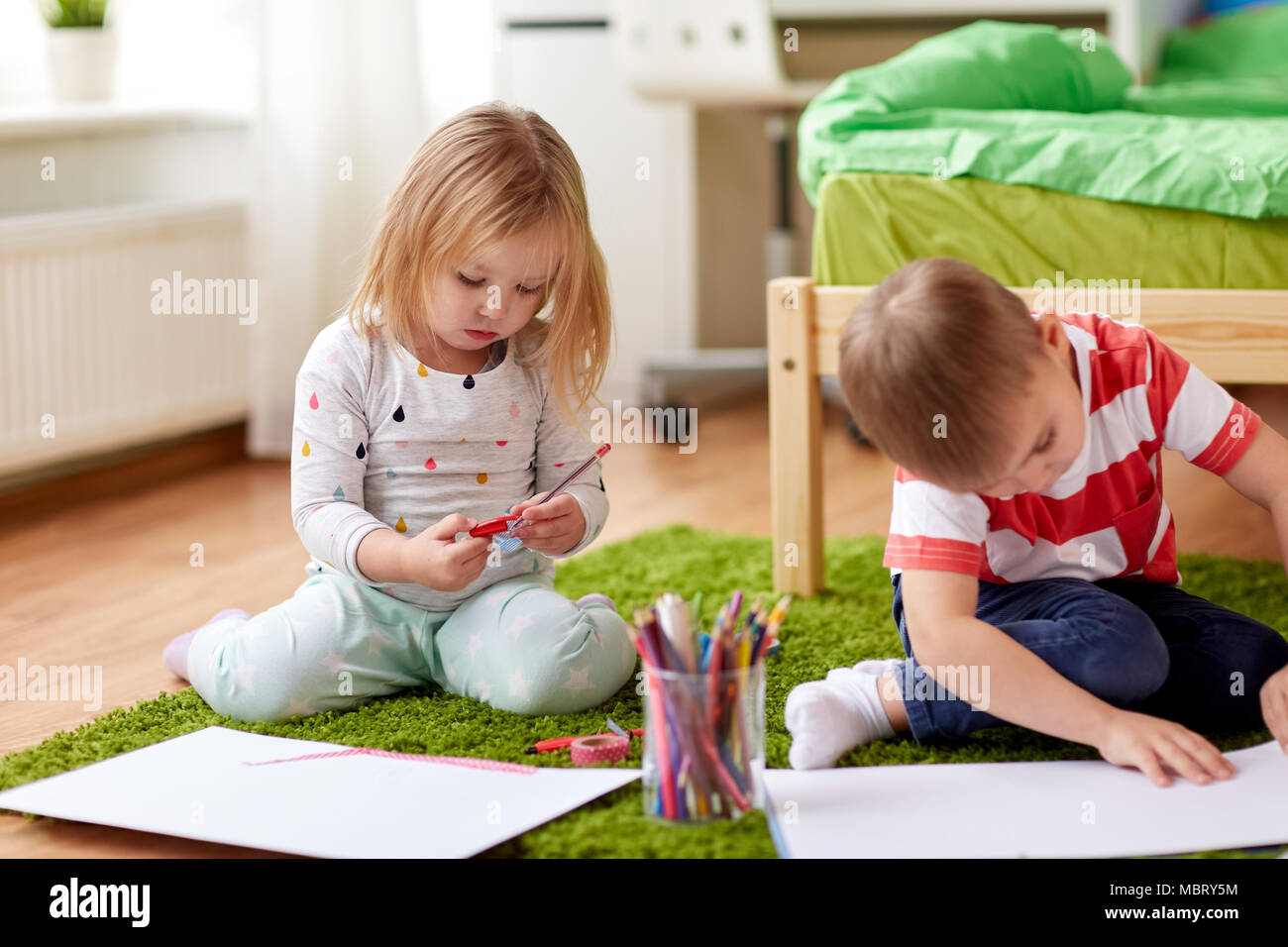 happy kids drawing at home Stock Photo - Alamy