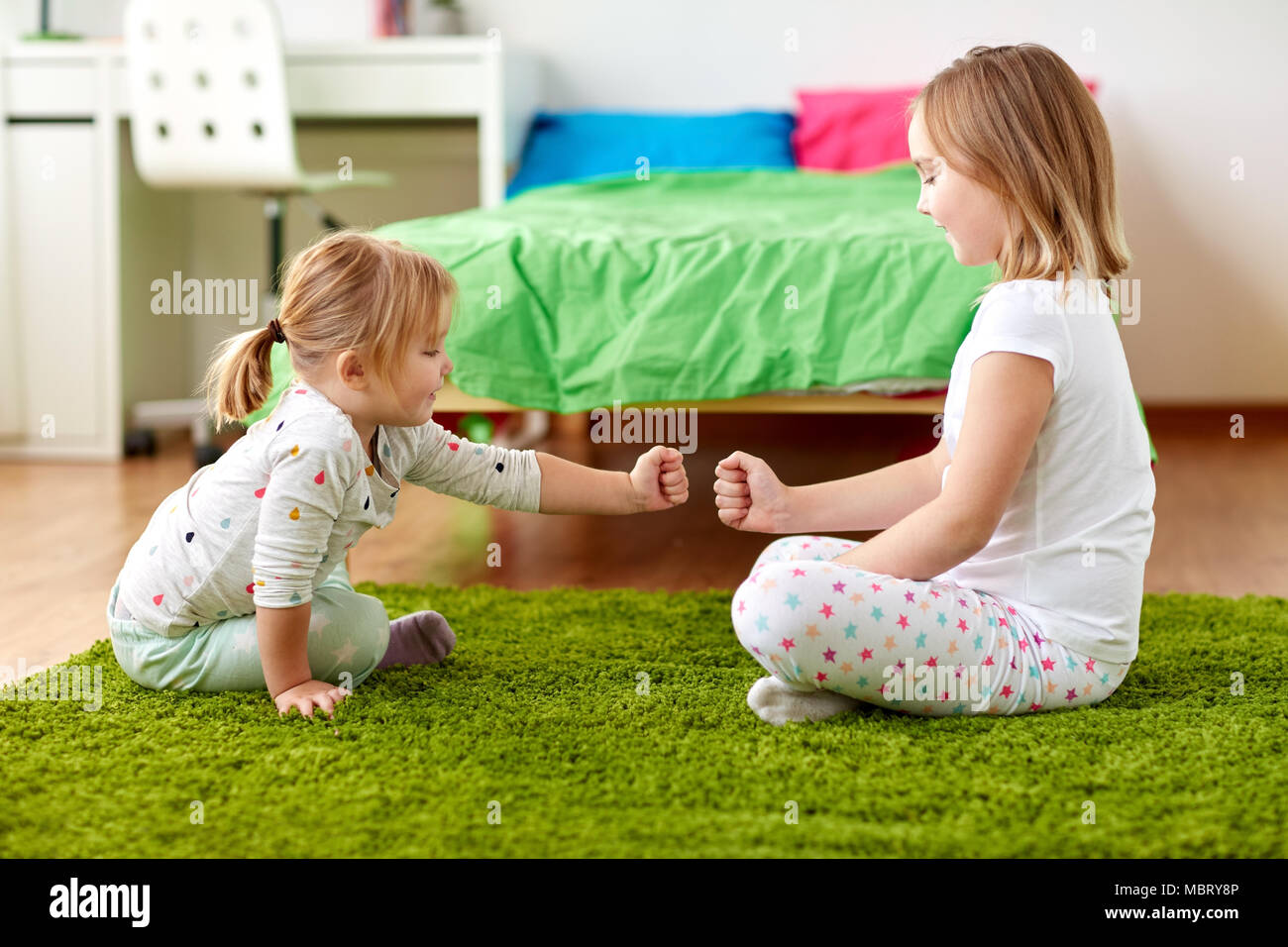 girls playing rock-paper-scissors game at home Stock Photo - Alamy