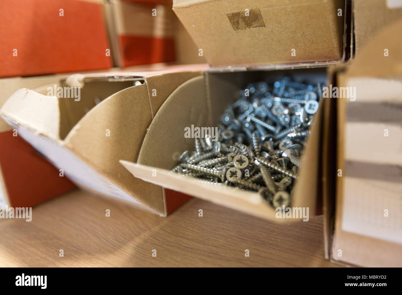 screws in cardboard boxes at workshop Stock Photo - Alamy