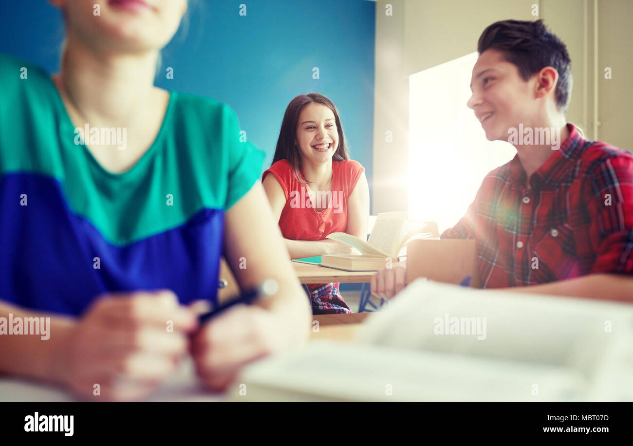 group of happy students talking at school break Stock Photo - Alamy