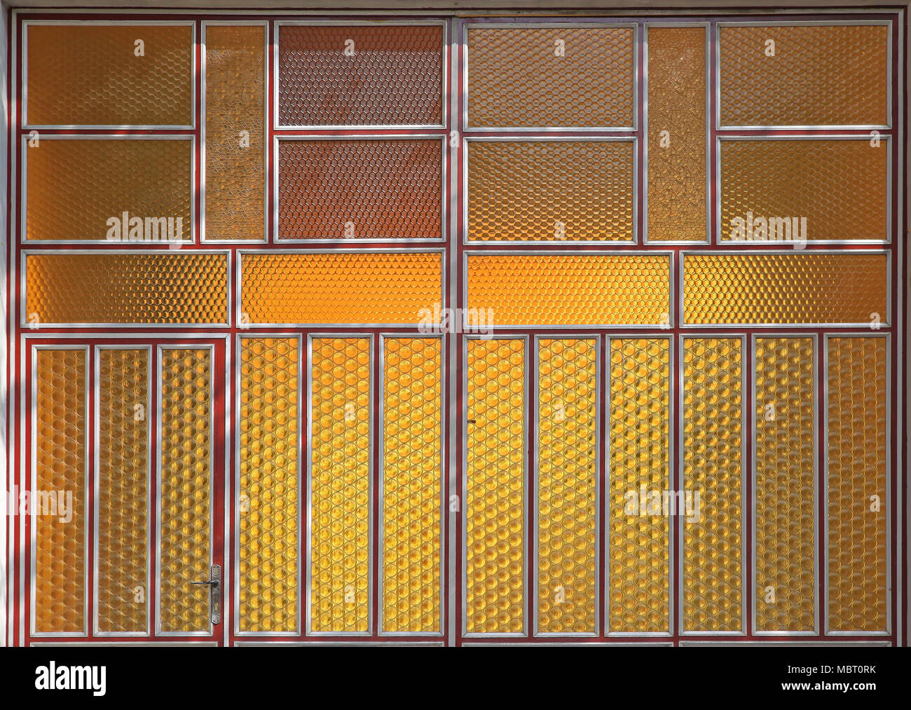 Yellow Privacy Glass Doors With Decorative Structure Stock Photo - Alamy