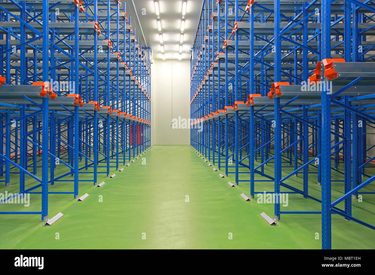 Empty Blue Shelving System in New Warehouse Stock Photo - Alamy