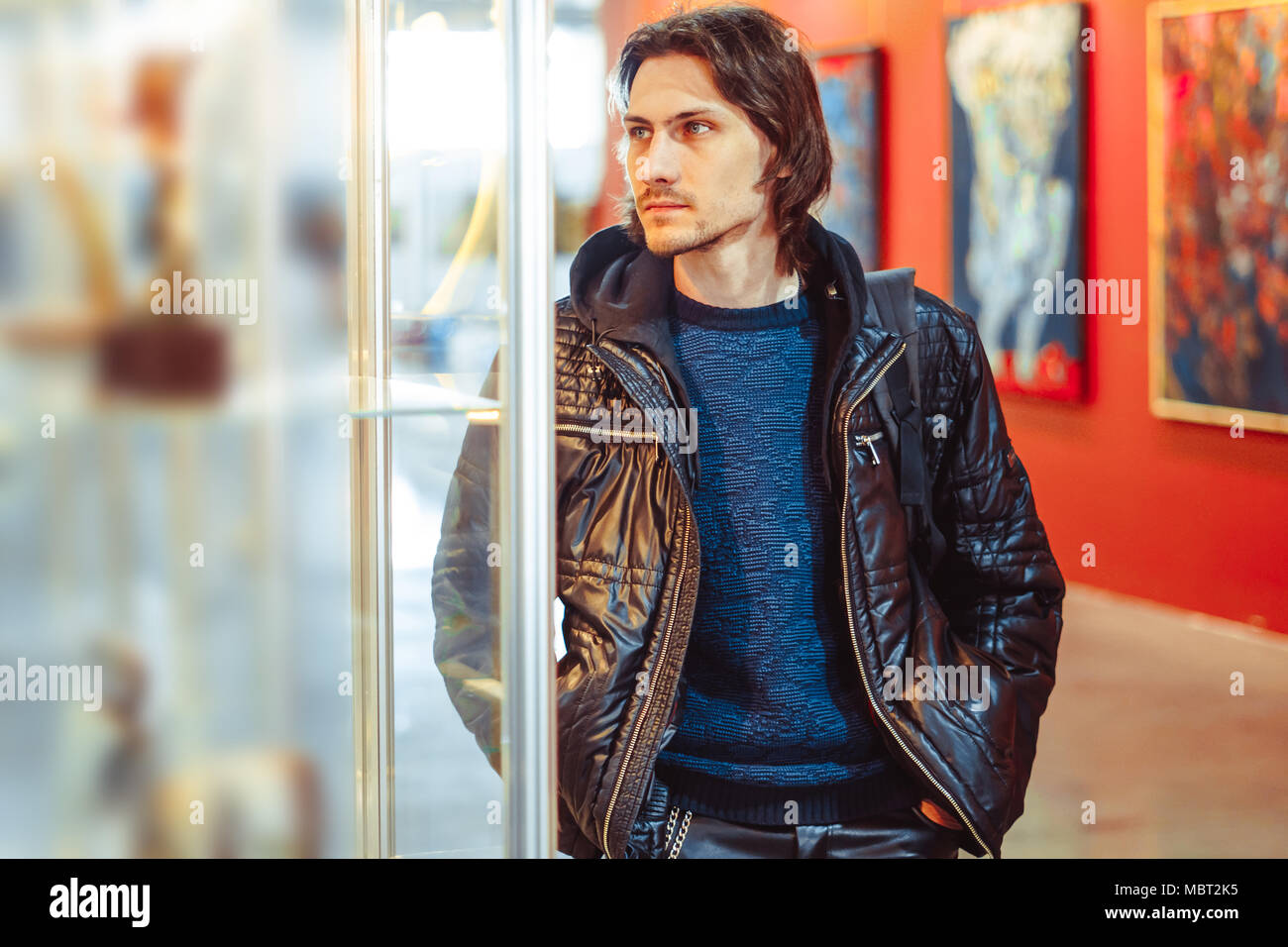 the guy is standing in front of an exhibit at the Museum Stock Photo ...