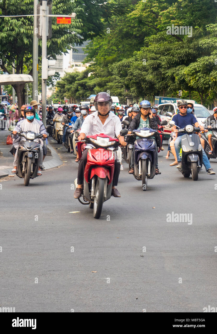 Vietnamese riding scooters hi-res stock photography and images - Alamy