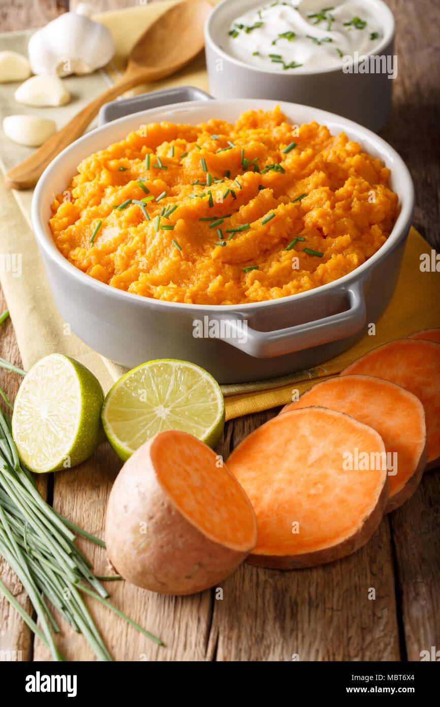 Homemade puree of sweet potato with ingredients close-up in a bowl on ...