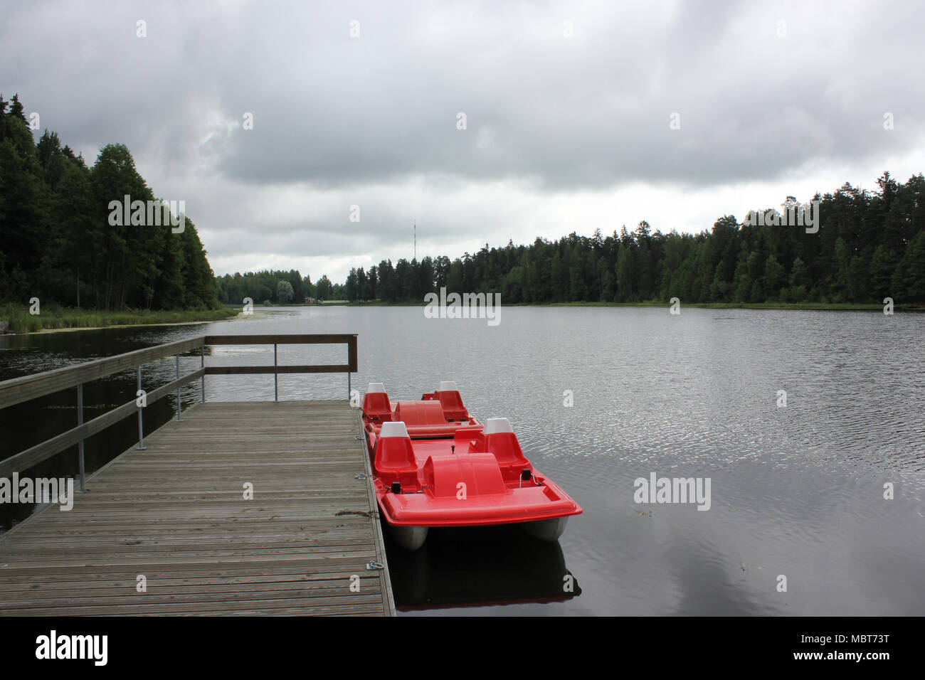 beautiful calm lake landscape with a catamaran Stock Photo - Alamy