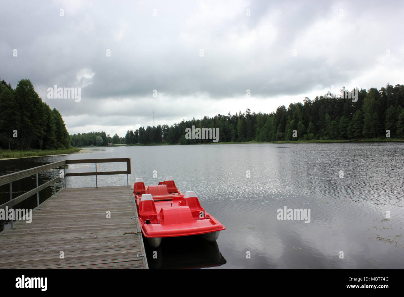 beautiful calm lake landscape with a catamaran Stock Photo - Alamy