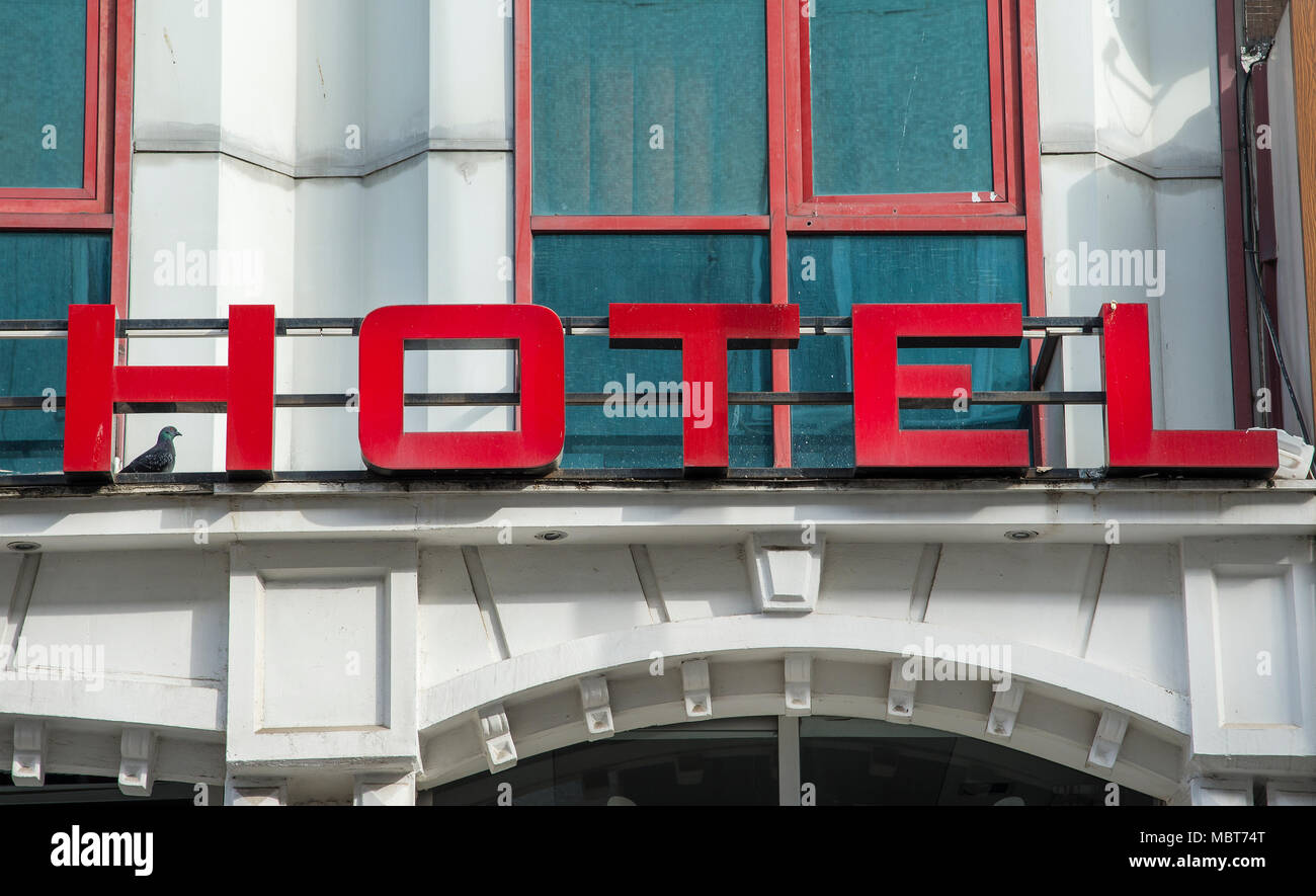 Hotel sign on the wall in the city Stock Photo - Alamy