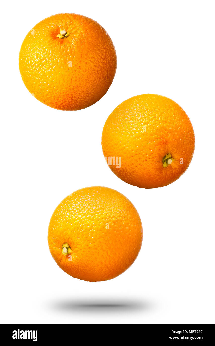Falling oranges fruit isolated on white background Stock Photo - Alamy