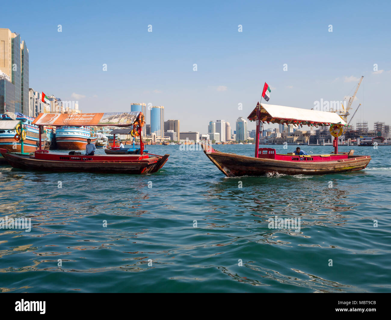 DUBAI,UAE - DECEMBER 19, 2017: Abra ferries crossing Dubai Creek that ...