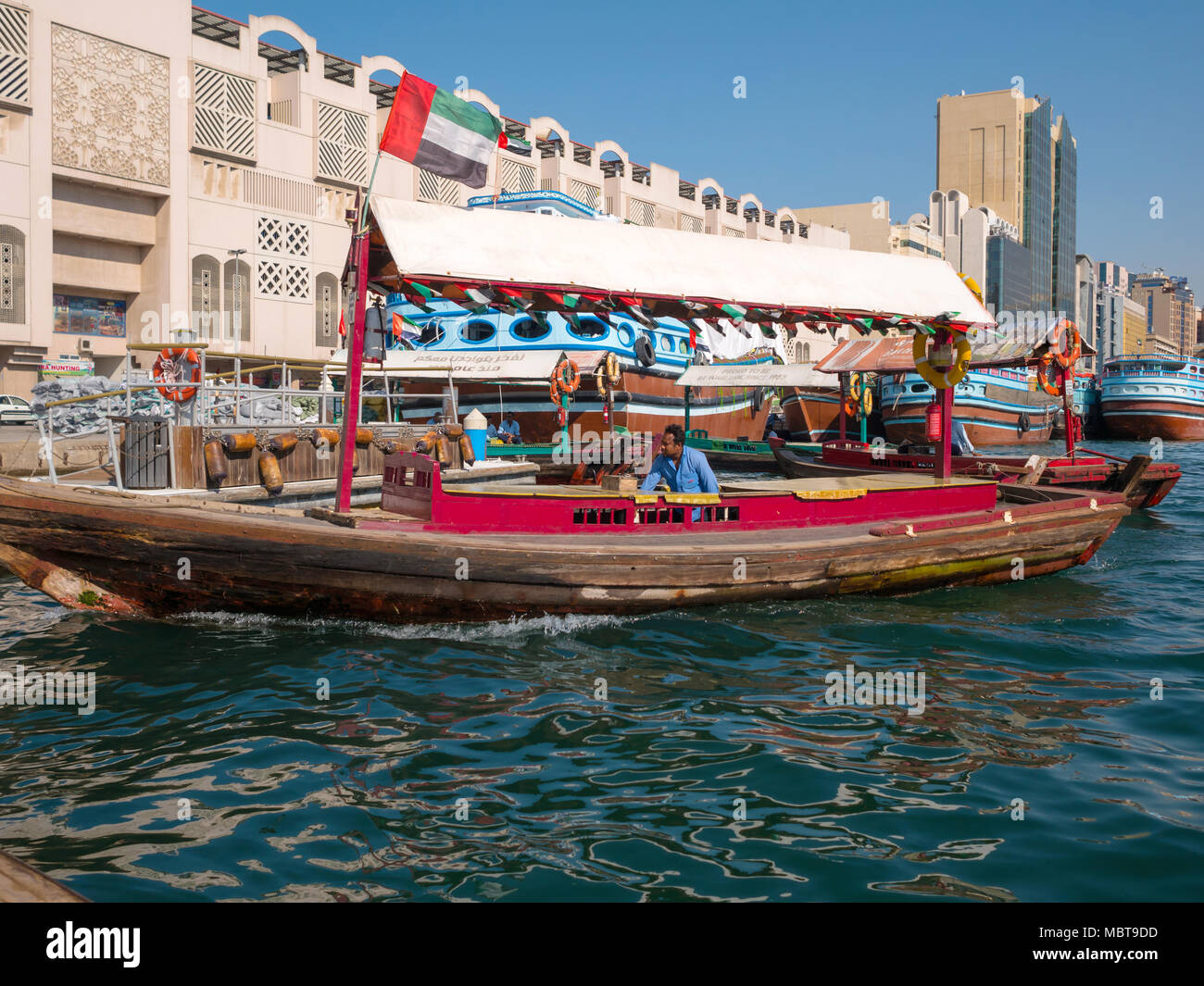 DUBAI,UAE - DECEMBER 19, 2017: Abra ferries crossing Dubai Creek that ...