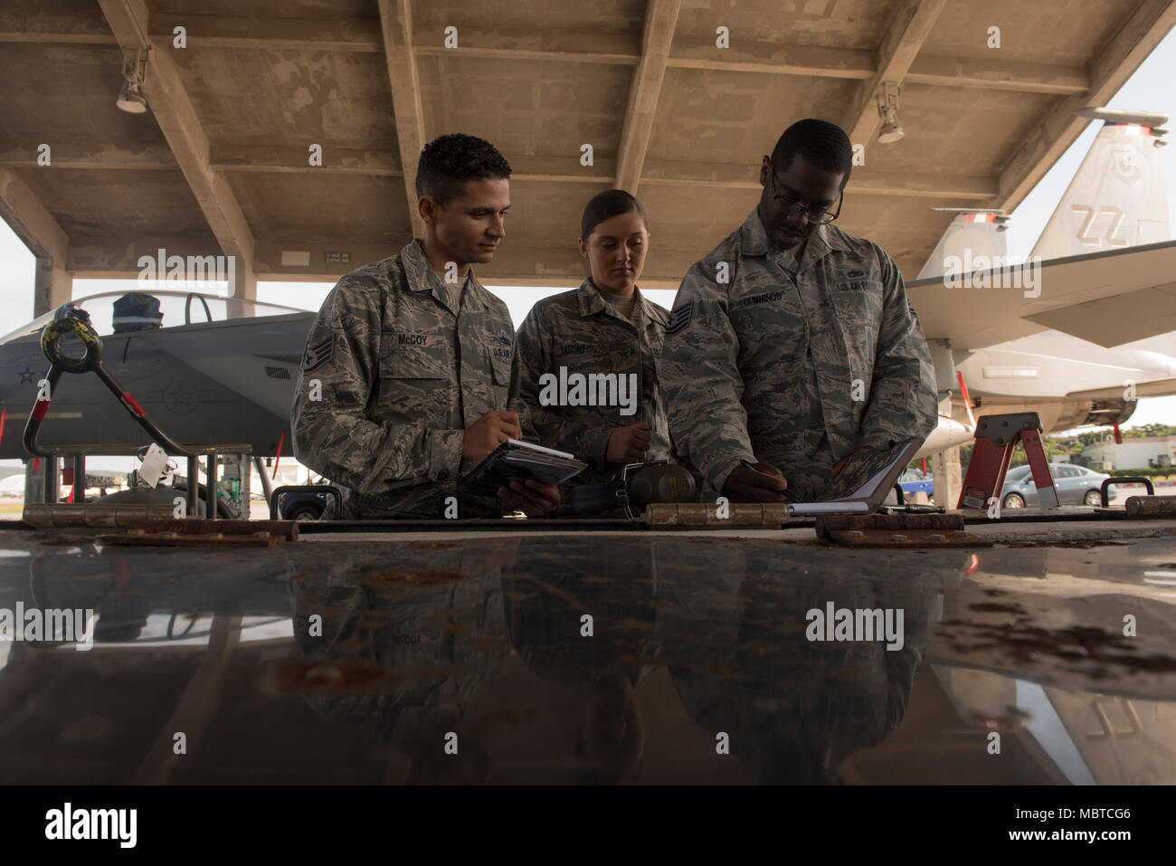 U.S. Air Force Staff Sgt. Michael McCoy, left, 18th Maintenance Group ...