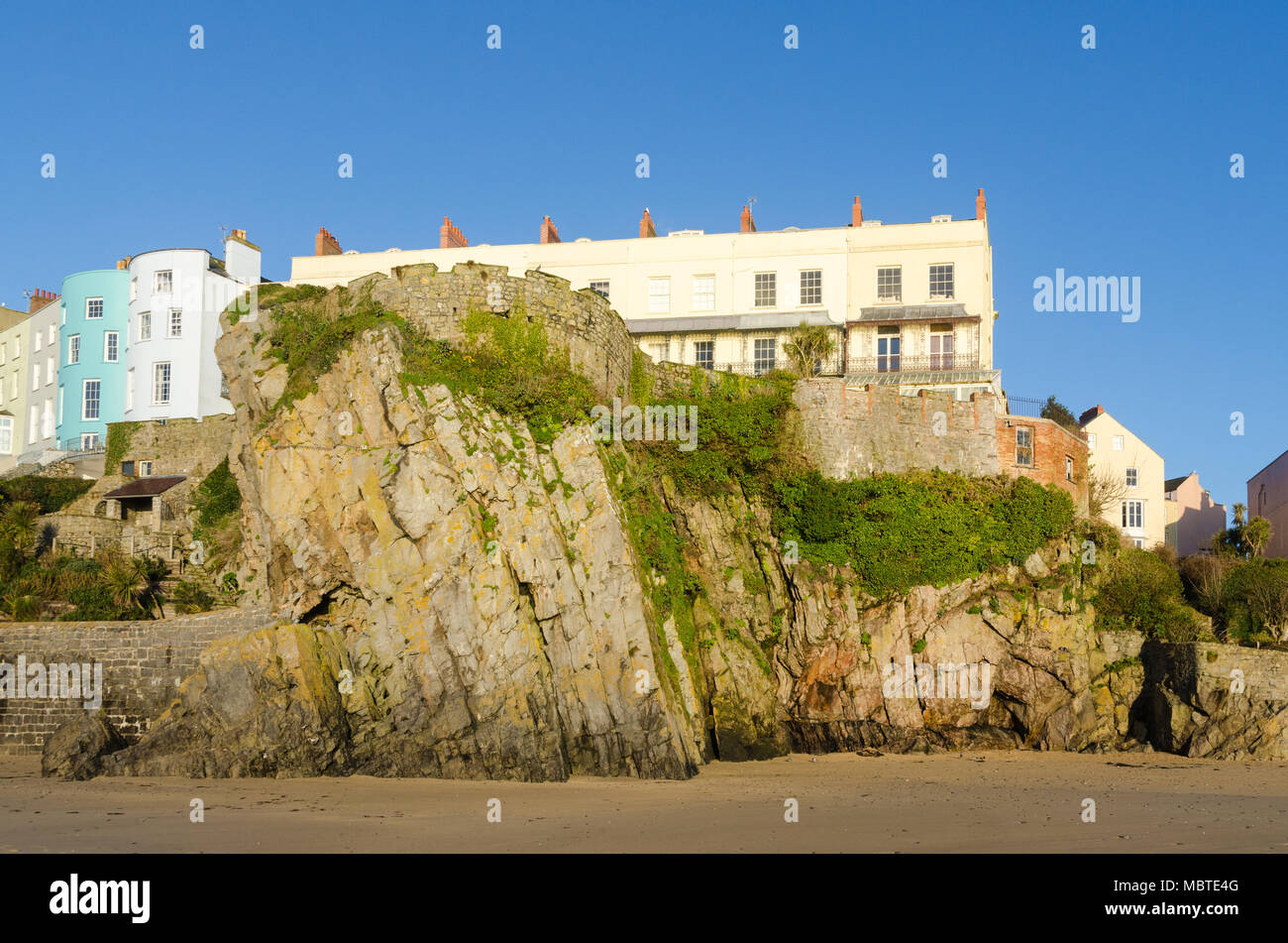 Colourful houses overlooking Castle Beach, Tenby in the early morning ...