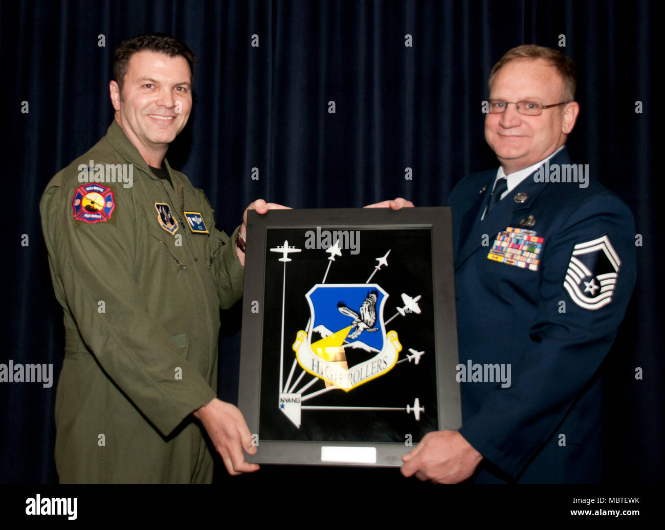 Senior Master Sgt. Rick Simpson receives his "High Roller Mirror" from ...