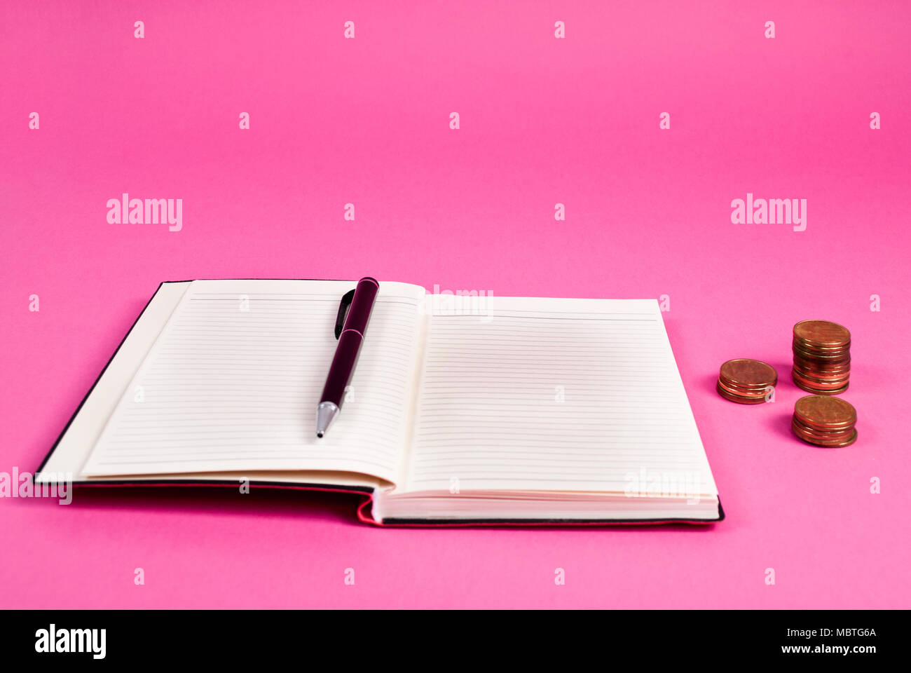 Notes and pencil and metal coins on a pink background Stock Photo - Alamy