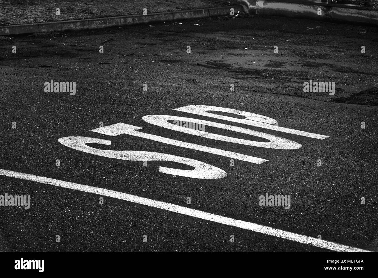 Road marking of Stop sign, street direction Stock Photo - Alamy
