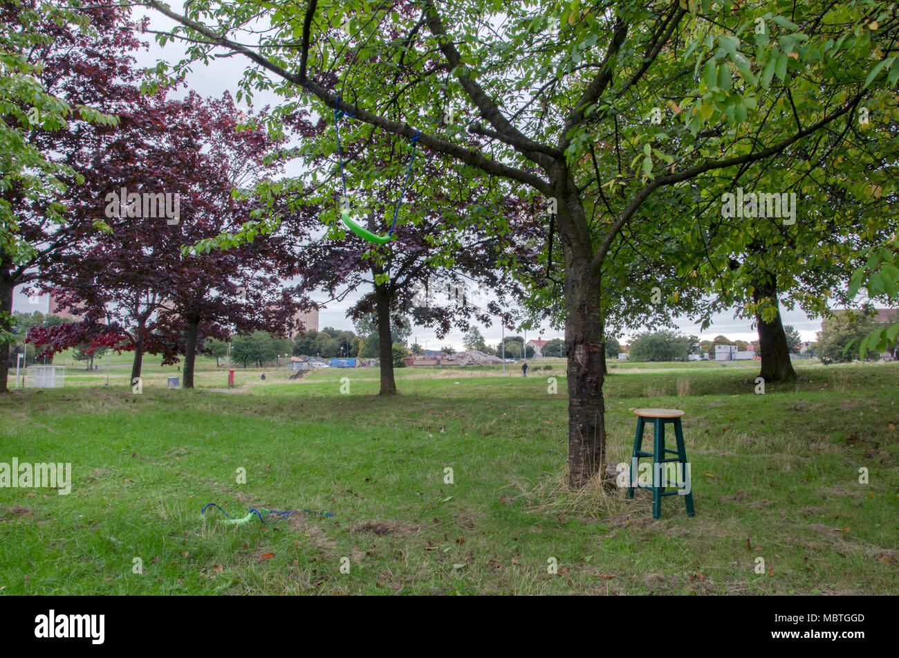 GLASGOW, SCOTLAND -SEPTEMBER 26TH 2013: A stool and a green swing in a ...