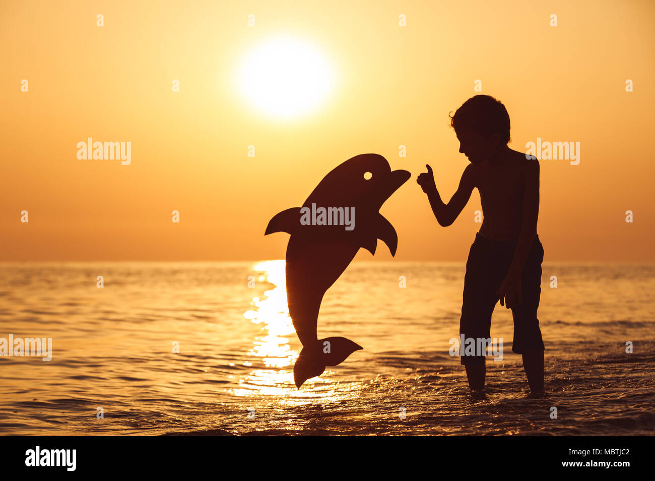 Boy On A Dolphin Stock Photos & Boy On A Dolphin Stock Images - Alamy