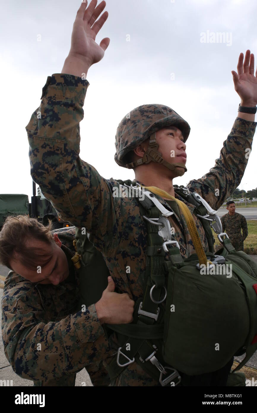 Sgt. Brendan Tuxbury (left), a parachute rigger with Air Delivery ...