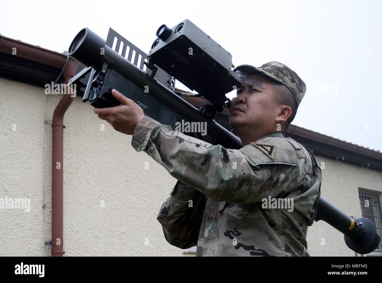 U.S. Army Capt. Richard Tran, an air defense officer, and an observer ...