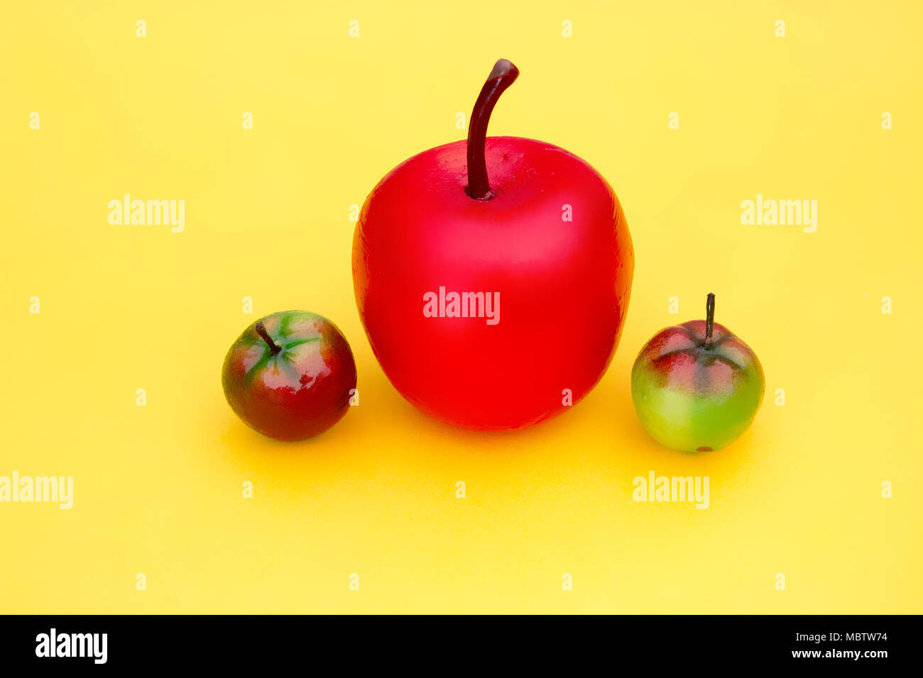 Decoration - red and green apples on a yellow background in pastel ...