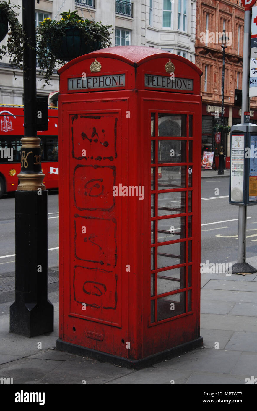 Traditional red phone both on the street of London, England. United ...