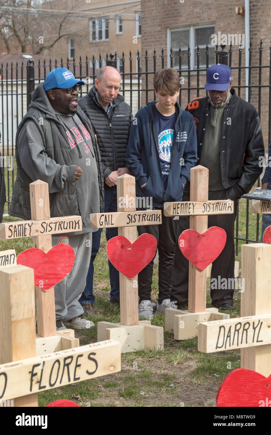 Chicago, Illinois - Rev. Donovan Price (left) prays at a memorial ...