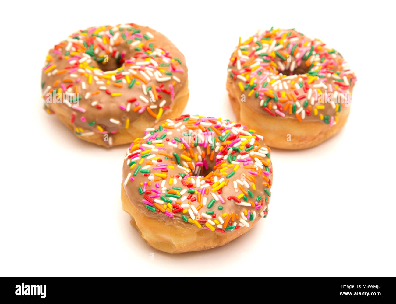Maple Sprinkle Donuts on a White Background Stock Photo - Alamy