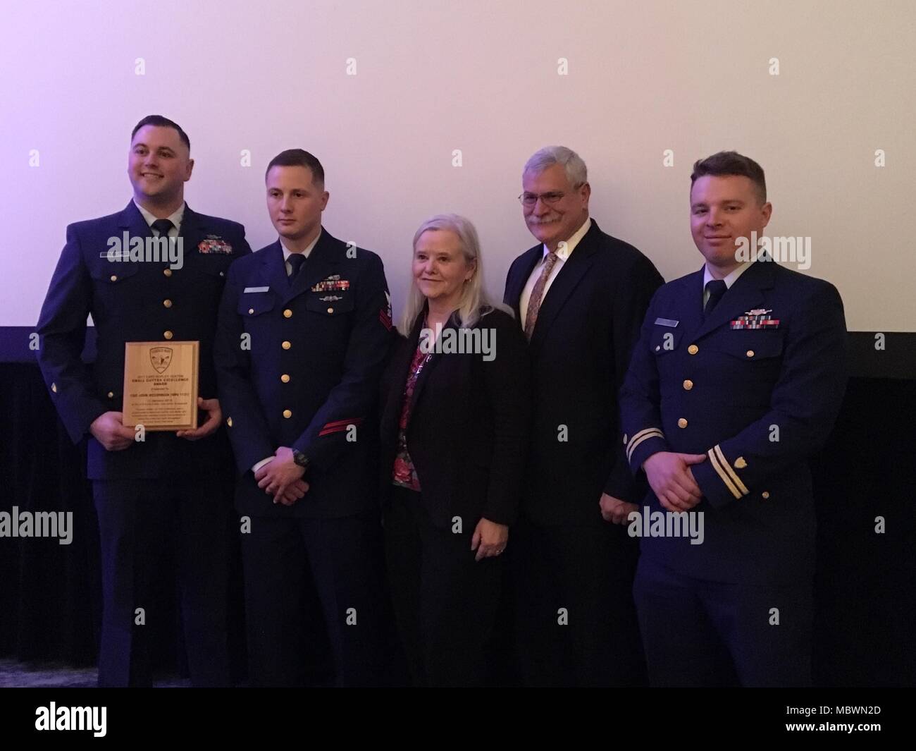 Members of the Coast Guard Cutter John McCormick alongside the parents ...