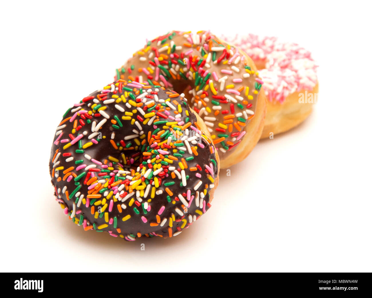 Various Flavored Sprinkle Donuts on a White Background Stock Photo - Alamy